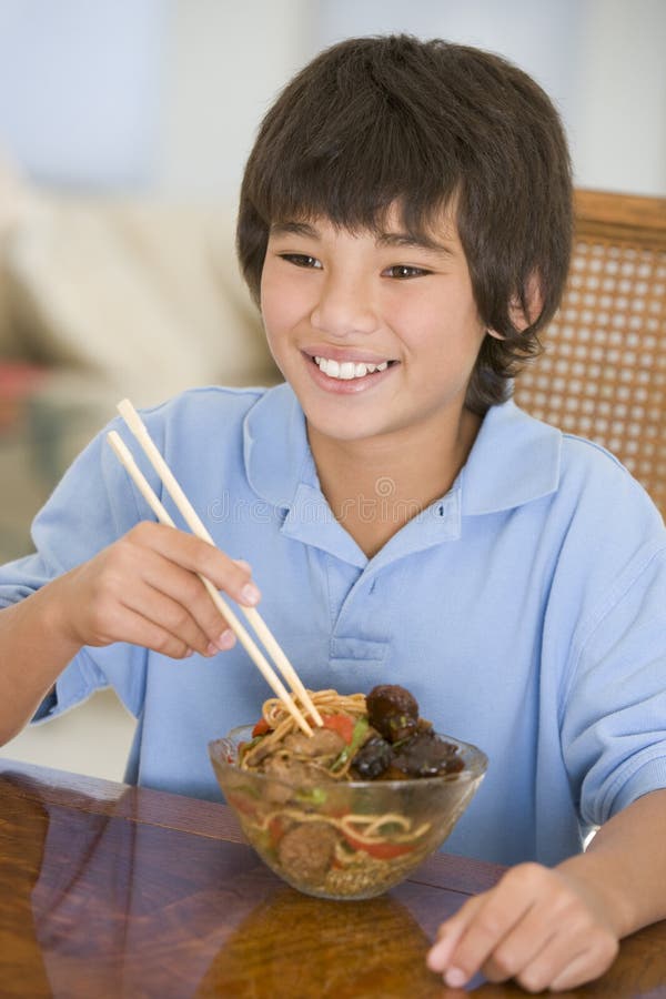 Young Boy in Dining Room Eating Chinese Food Stock Photo - Image of ...