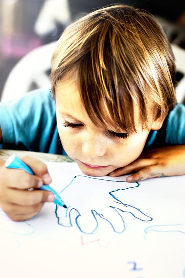 A Young Boy is Doing Drawing Stock Photo - Image of hope, childhood ...