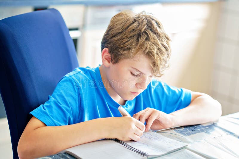 Young Boy Doing His Homework at Home. School Kid Learning Stock Image ...