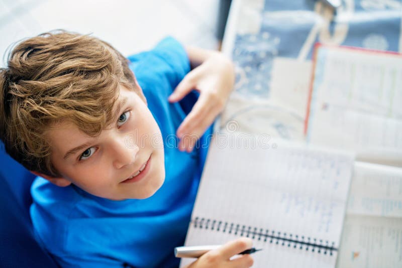 Young Boy Doing His Homework at Home. School Kid Learning. Stock Image ...