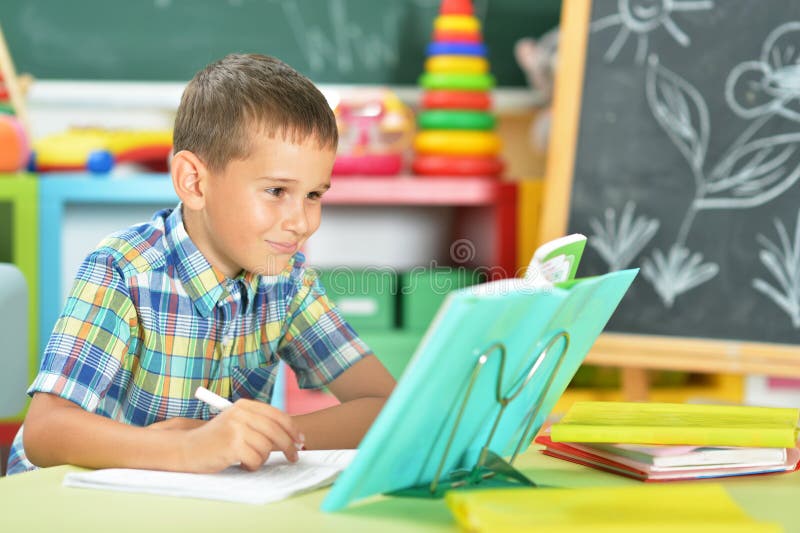 Young boy doing homework stock photo. Image of teenager - 254418260