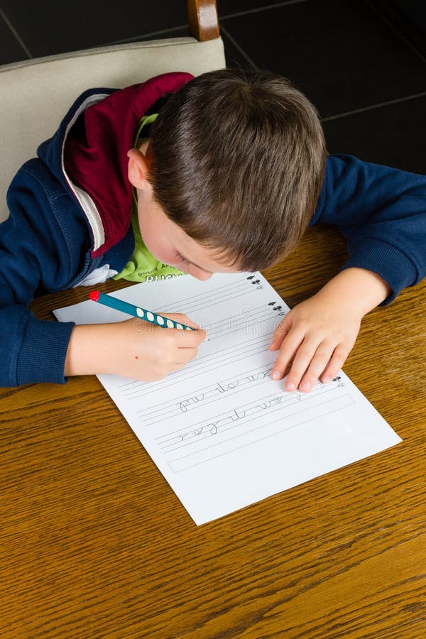 Young boy doing homework stock photo. Image of boys, people - 80408884