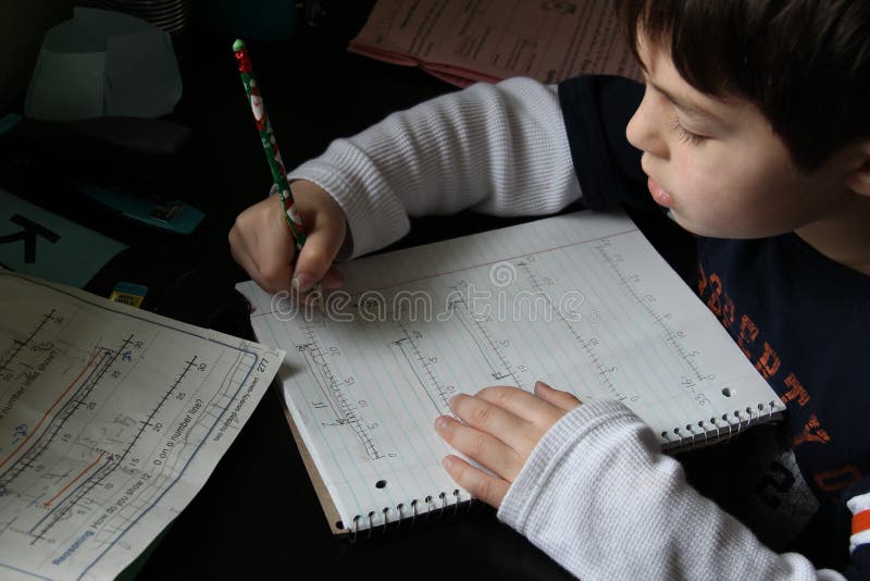 Young boy doing homework stock photo. Image of pencil - 37951854