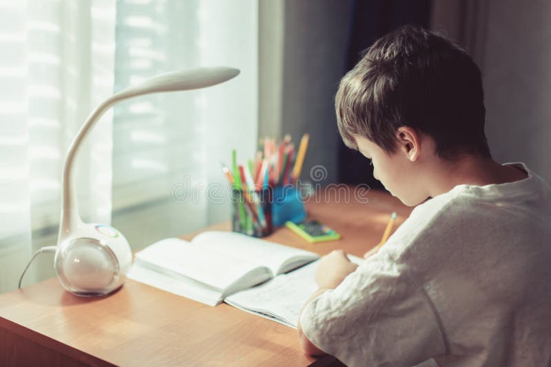 Young Boy Doing Homework or Learning at Home Stock Image - Image of ...
