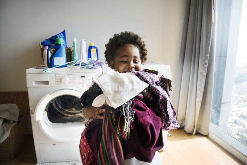 Young Boy Doing Housework at Home Stock Photo - Image of africa ...