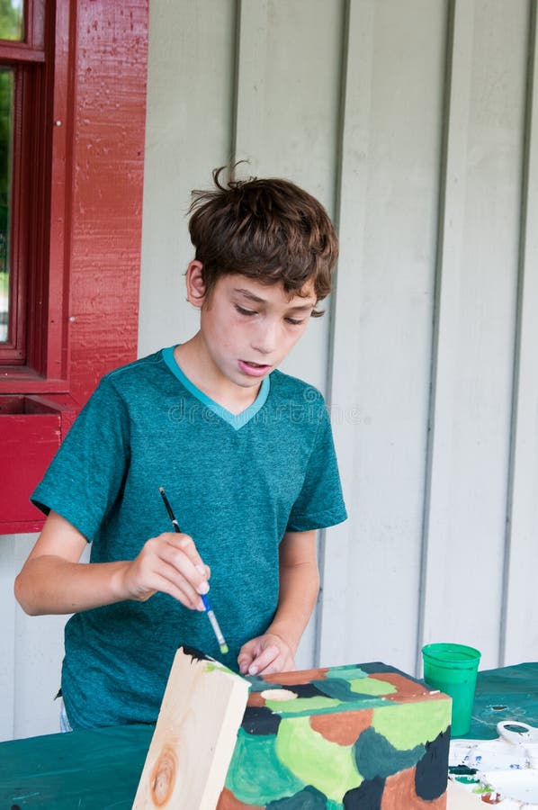 Young Boy Doing a Painting Craft Stock Photo - Image of birdhouse ...