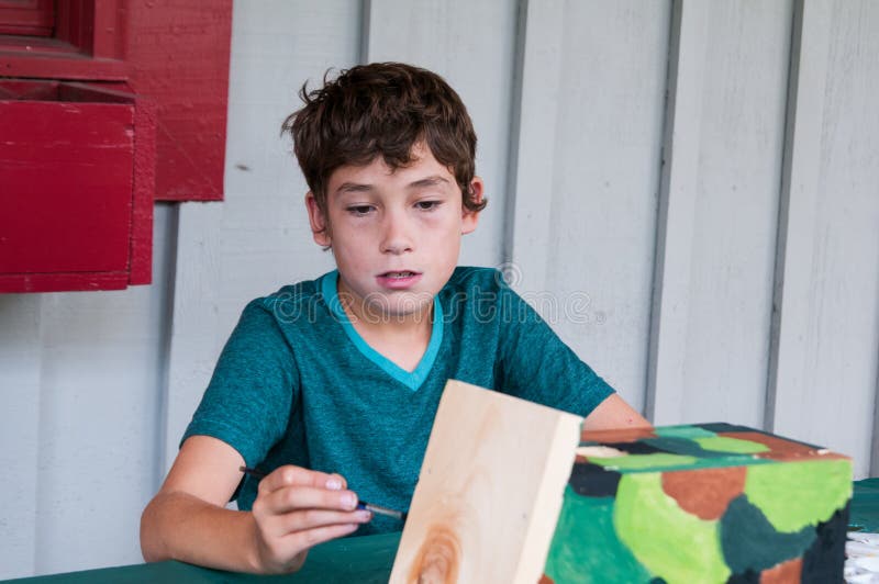 Young Boy Doing a Painting Craft Stock Photo - Image of young, project ...