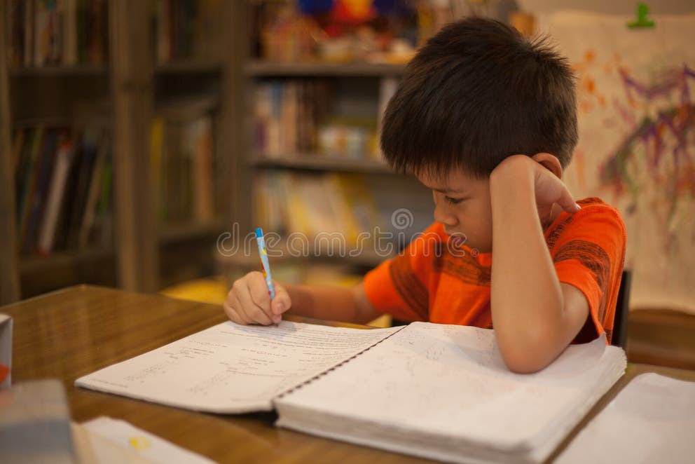 Young Boy Doing School Work Stock Photo - Image of answer, difficult ...