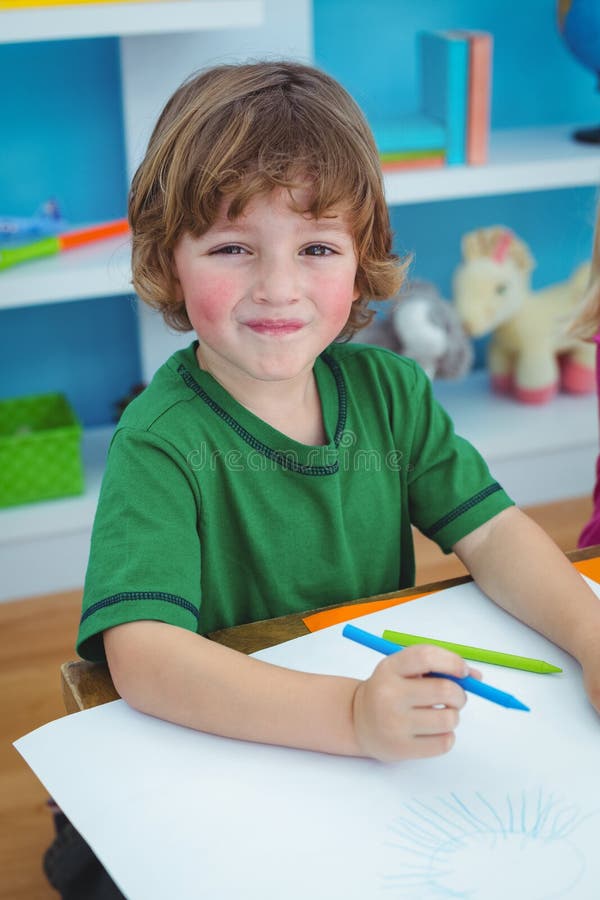 Young boy drawing on paper stock photo. Image of paper - 61438254