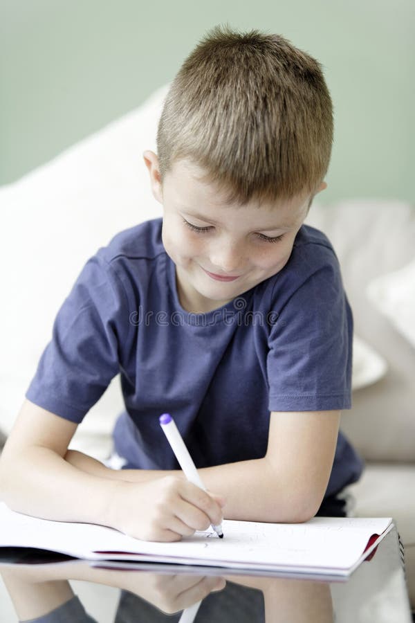 Young Boy Drawing and Writing Stock Image - Image of writing, lifestyle ...