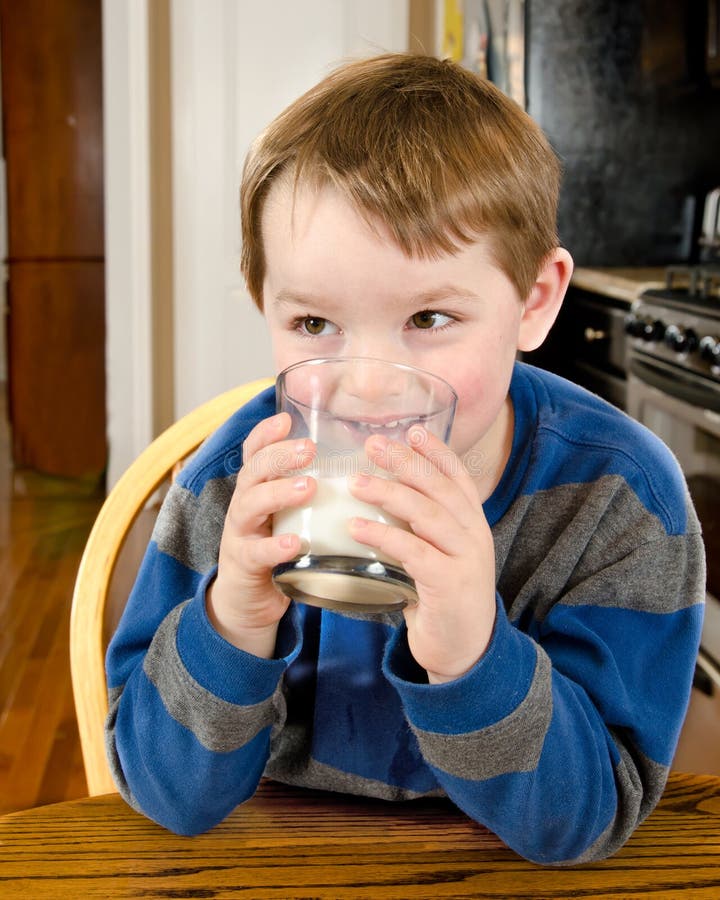 Young boy drinking milk stock image. Image of people - 25782769
