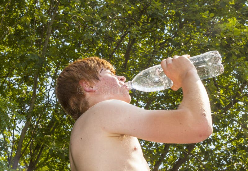 Young boy drinks water out stock image. Image of male - 35363805