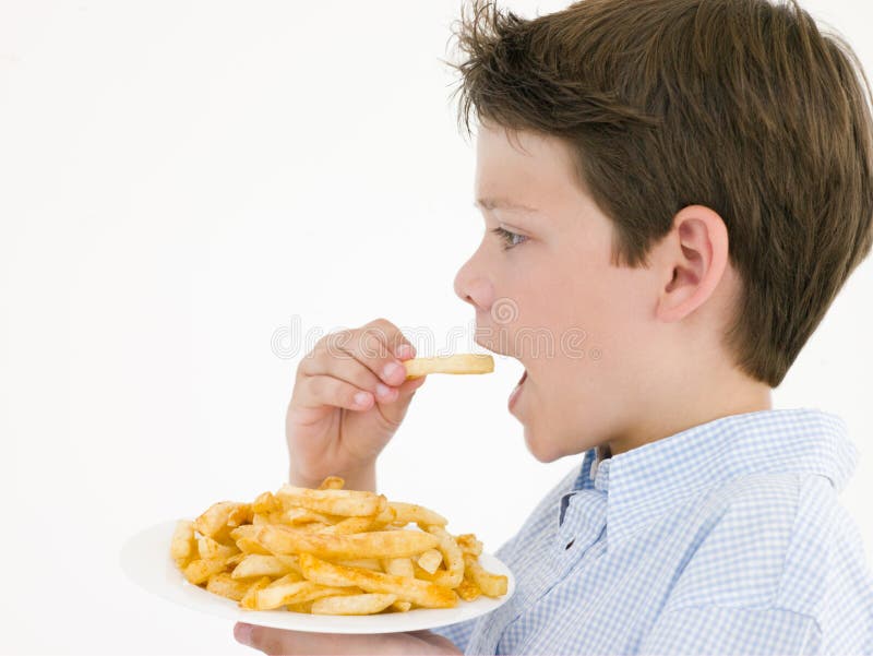 Young boy eating stock image. Image of emotion, camera - 5945849