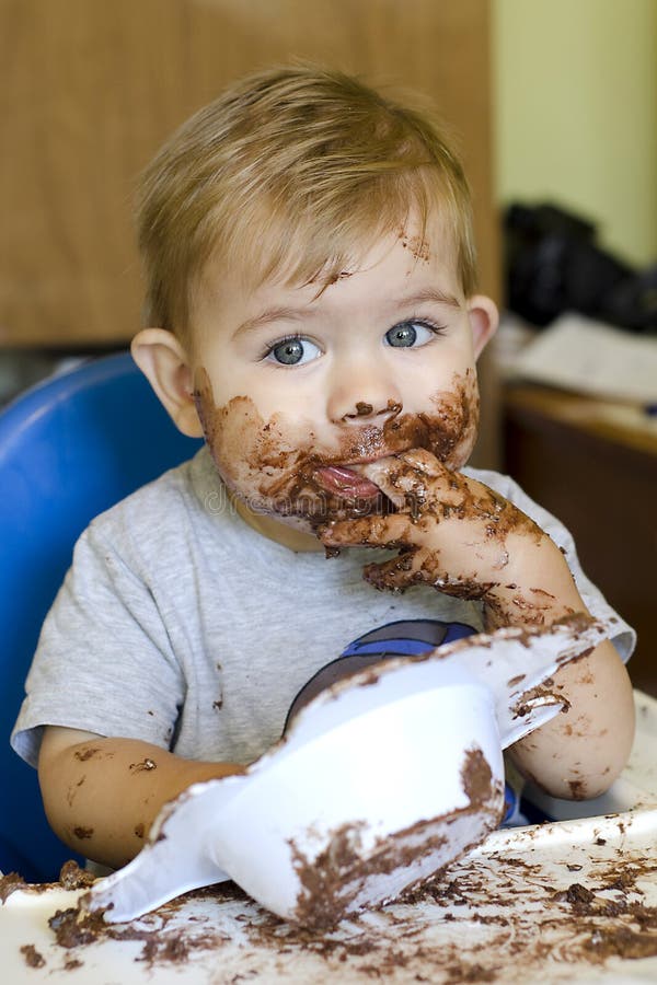 Young boy eating cake stock image. Image of male, beautiful - 26982571