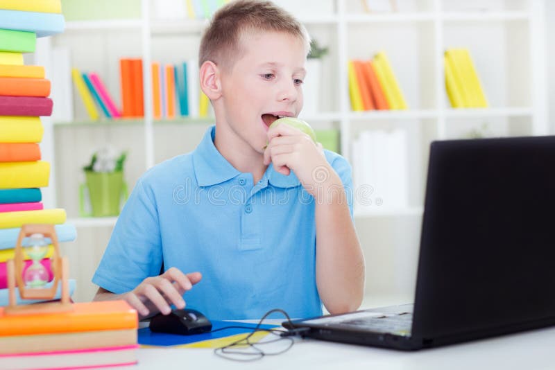 Young Boy Eating a Green Apple and Study Stock Image - Image of child ...