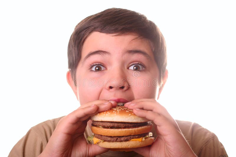 Happy boy eating burger stock image. Image of male, burger - 31478251