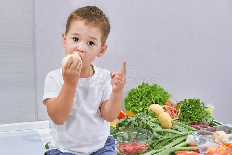 Young Boy Eating Healthy Meal Seated at a Table Stock Photo - Image of ...