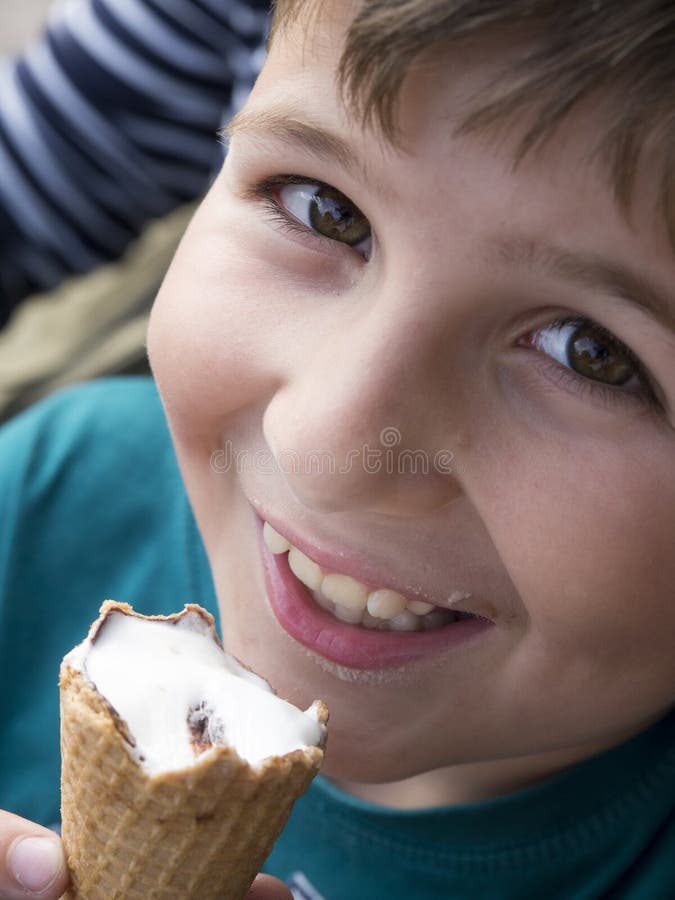 Young boy eating ice cream stock photo. Image of seasonal - 53878778