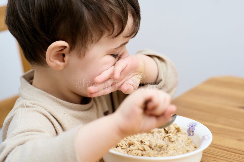 Young Boy Eating Oatmeal for Breakfast Stock Image - Image of childhood ...