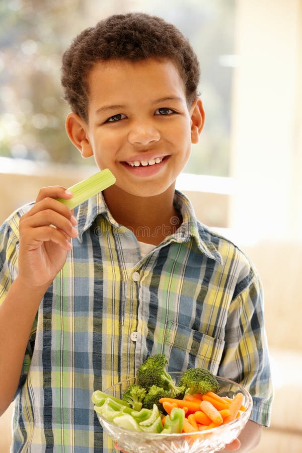 Young Boy Eating Raw Vegetables Stock Photo - Image of health, enjoying ...