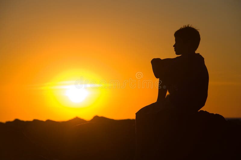 Young Boy Enjoying Sunset Royalty Free Stock Image - Image: 21909326