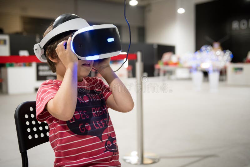 Young Boy Exploring Computer Simulation Using Virtual Reality Glasses ...
