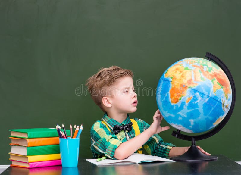 Young Boy Exploring the Globe Stock Photo - Image of male, blank: 88578182