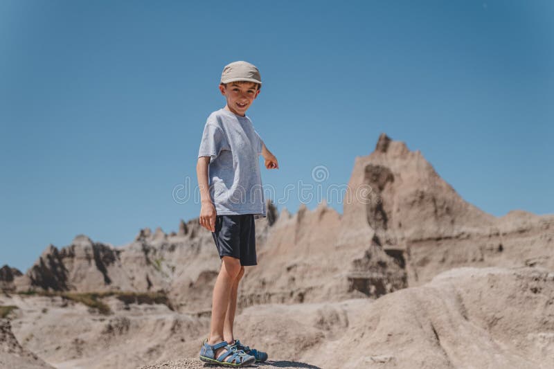 Young Boy Exploring the Rock Formations of Badlands National Park Stock ...