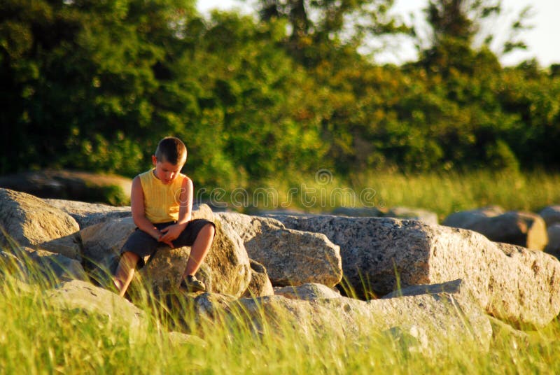 A Young Boy Feeling Alone and Vulnerable Stock Image - Image of ...
