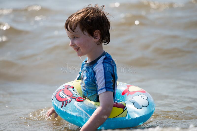 248 Child Floating Inner Tube Stock Photos - Free & Royalty-Free Stock ...