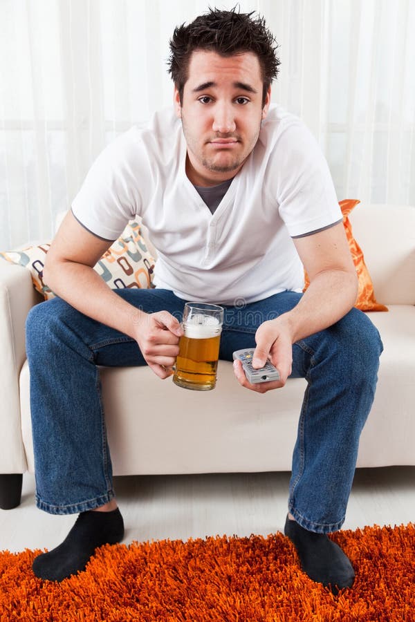 Young Boy With A Glass Of Beer And Remote Control Picture. Image: 18076237