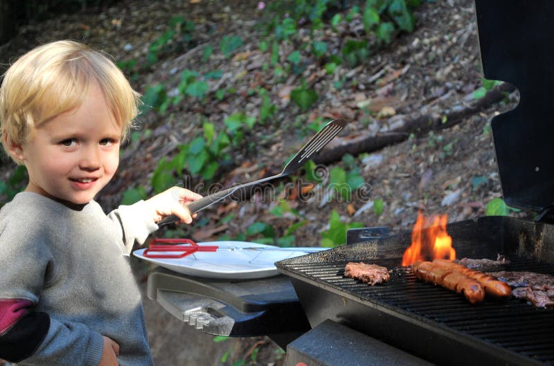 Young boy grilling food stock photo. Image of food, hamburgers - 10064128