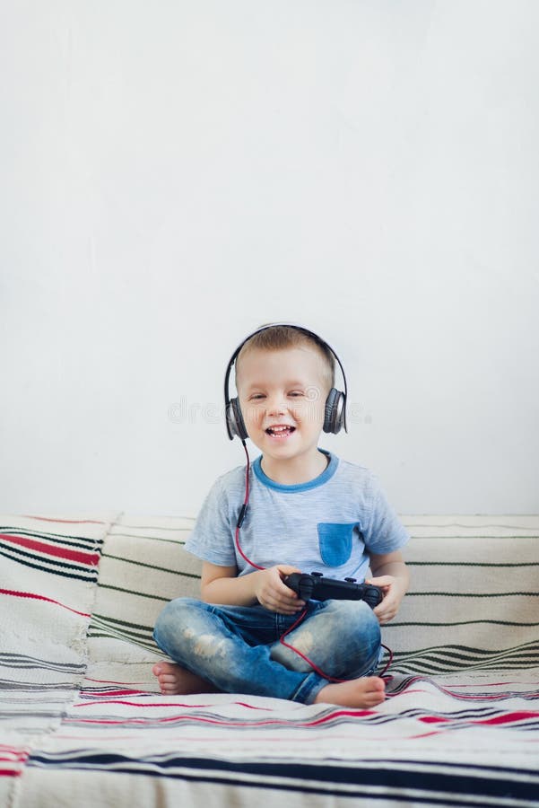 Young Boy Headphone Playing Playstation Home Stock Photos - Free ...