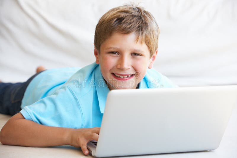 Young Boy on His Laptop Computer Stock Image - Image of camera, lying ...