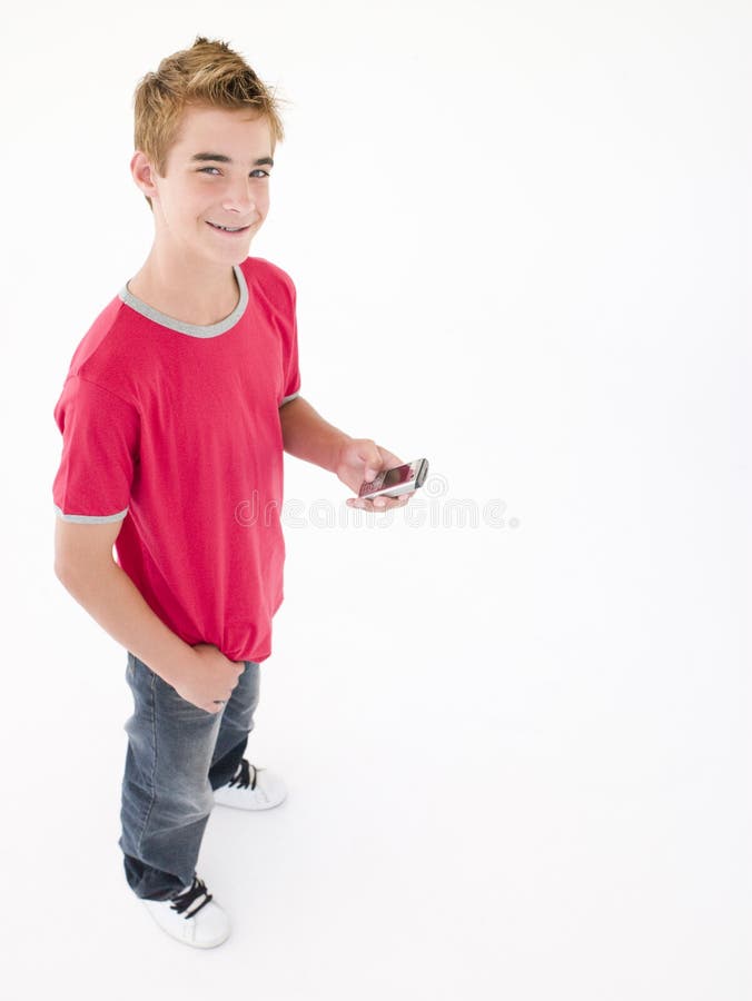 Young Boy Holding Cellular Phone and Smiling Stock Photo - Image of ...