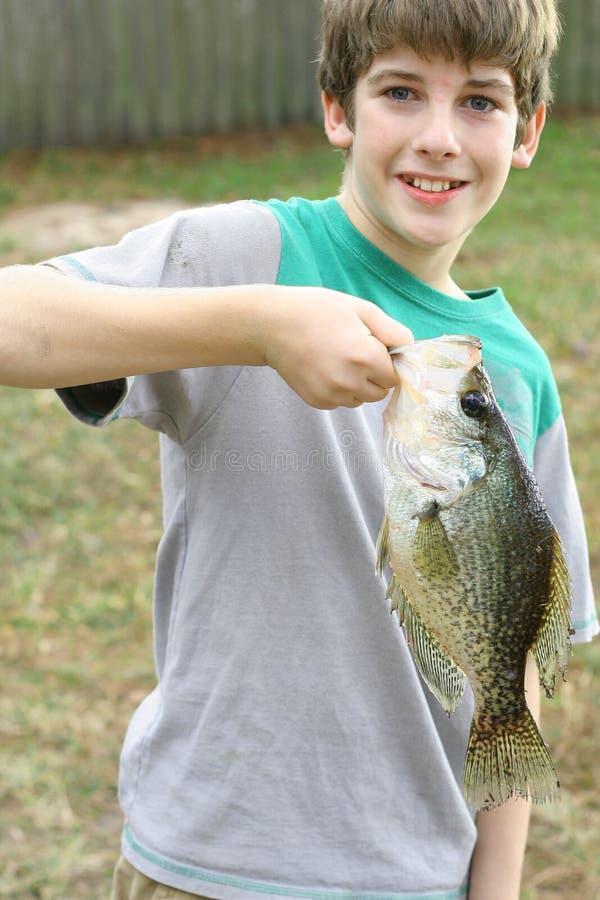 Young Boy Holding Fish he Caught Stock Image - Image of fishing, catch ...