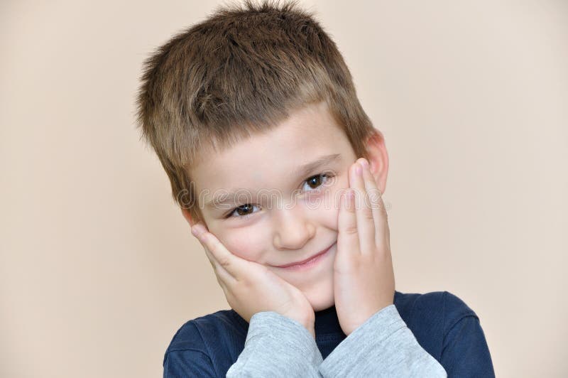 Young Boy Holding Hands on the Cheeks Stock Photo - Image of expression ...