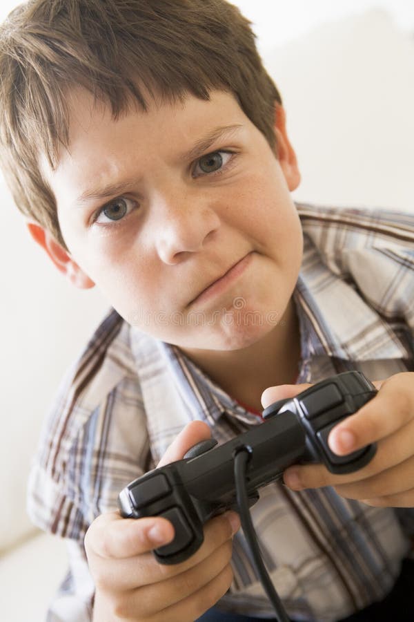 Boy Holding Controller Playing Video Game Stock Image - Image of male ...