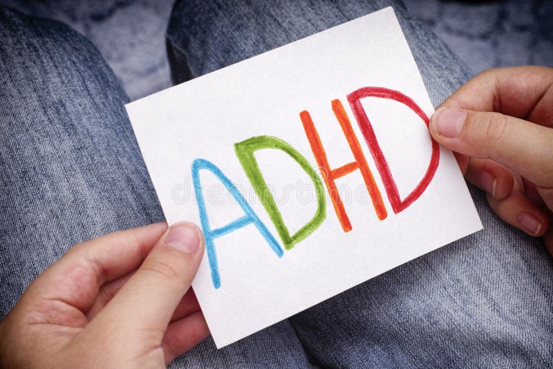 Young Boy Holds ADHD Text Written on Sheet of Paper Stock Image - Image ...