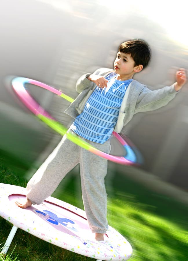A Young Boy with a Hoola Hoop Stock Image - Image of joyful ...