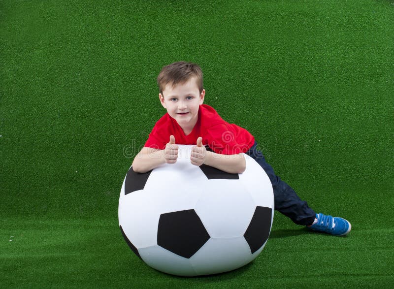 Young Kids with Huge Soccer Ball Stock Image - Image of green, ball ...