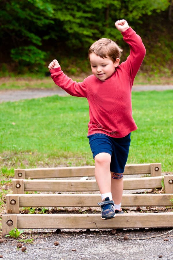 Young Boy Jumping Over Obstacle Stock Image - Image of preschool ...