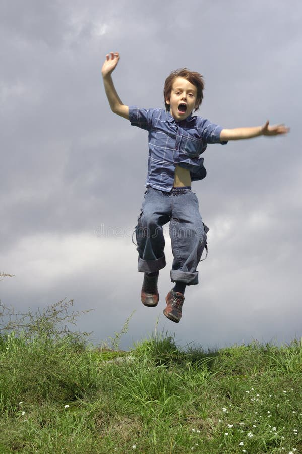 Young Boy Jumping and Shouting Stock Image - Image of weather, outdoors ...