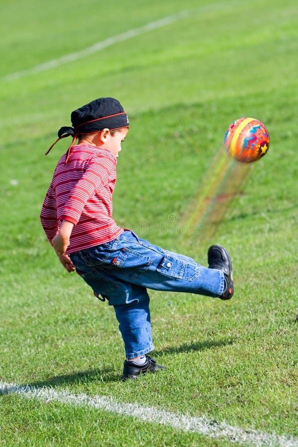 Young Boy Kicks Rubber Ball. Stock Image - Image of lifestyle, enjoy ...