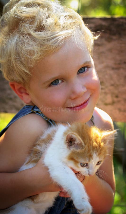 Young Boy with Kitten stock image. Image of cute, animal - 32632361