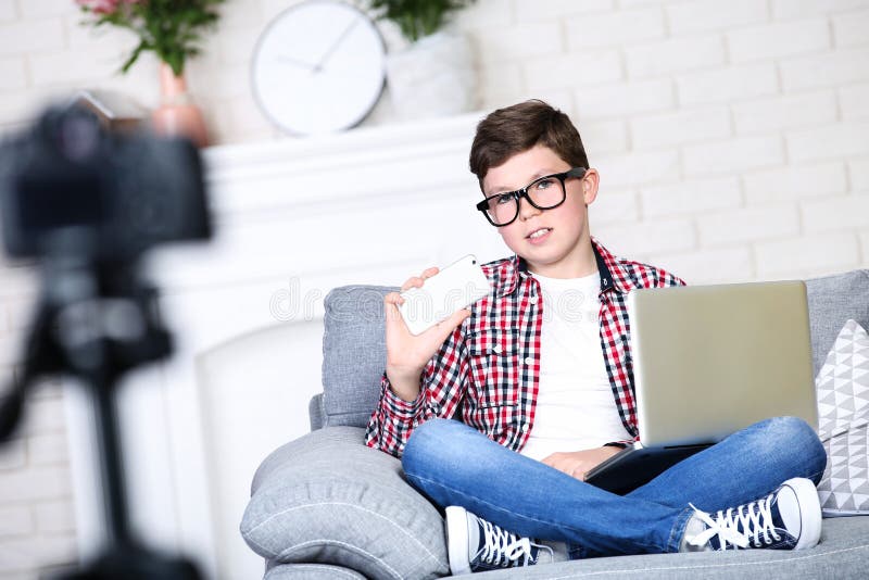 Boy with Laptop Sitting on Sofa Stock Photo - Image of notebook, people ...