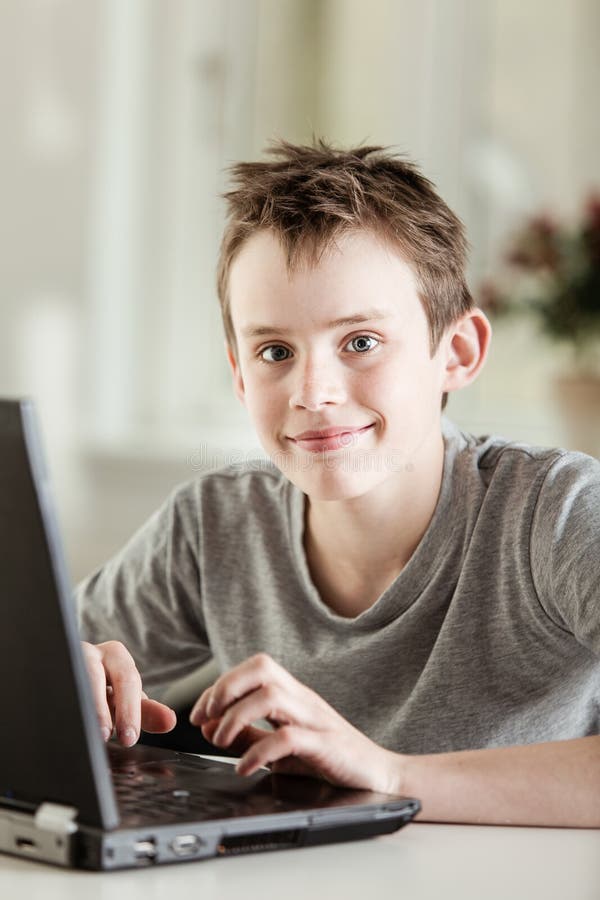 Young Boy with Laptop Smiling at the Camera Stock Image - Image of ...