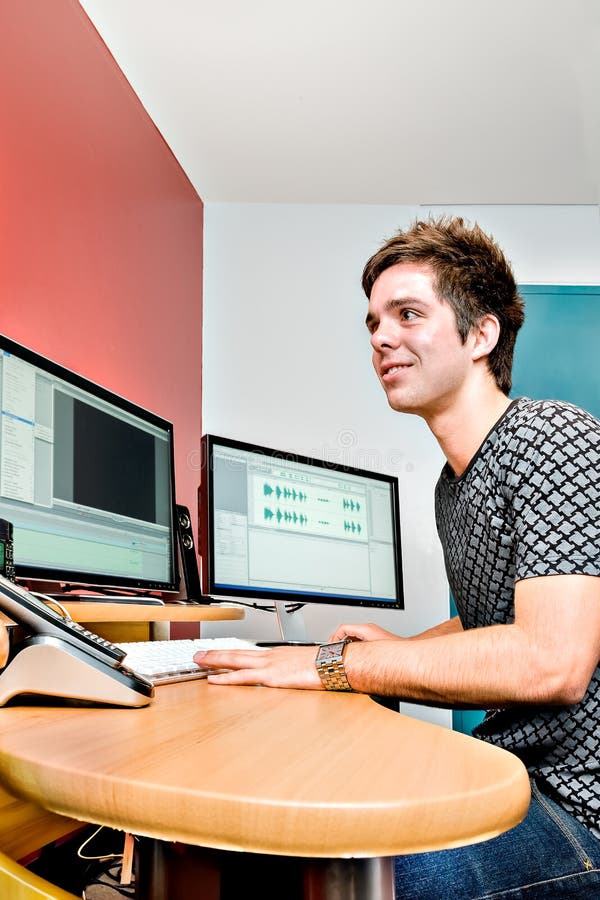 Young Boy Laughing And Operating An Editing Machine Stock Image - Image ...