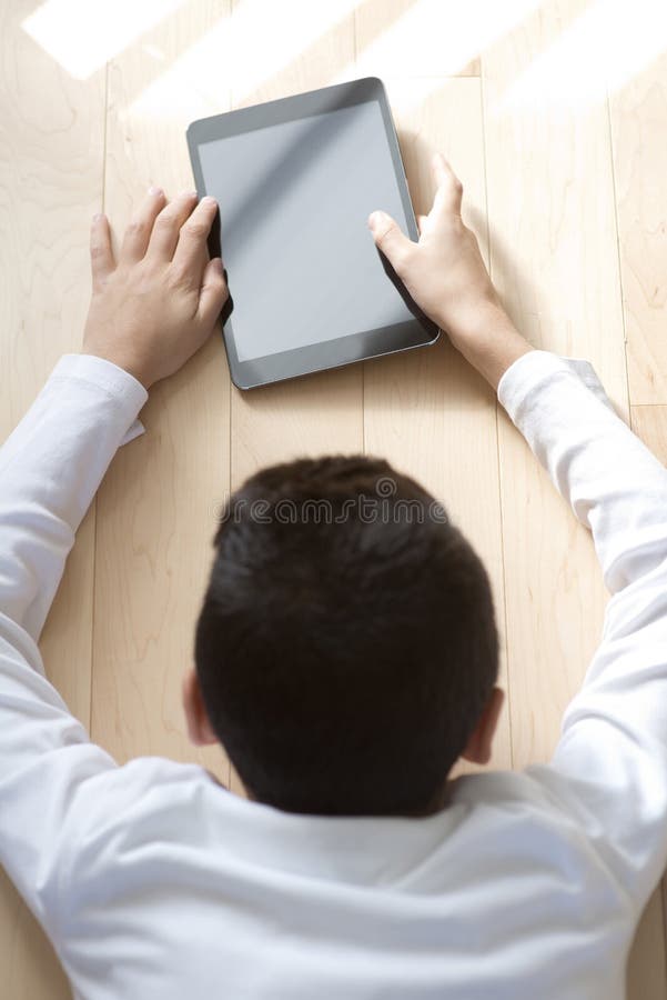 Young Boy Laying Down Mobile Tablet Computer Stock Photos - Free ...
