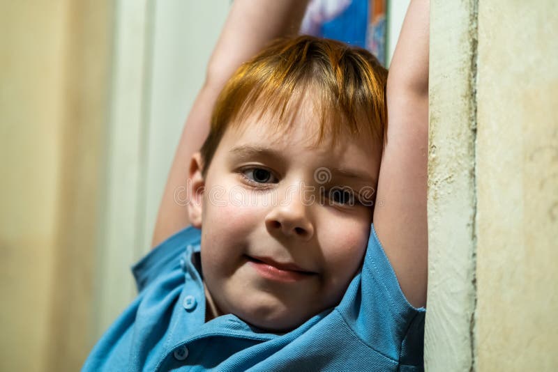 A Young Boy Leaned Against a Wall at Home Stock Image - Image of ...